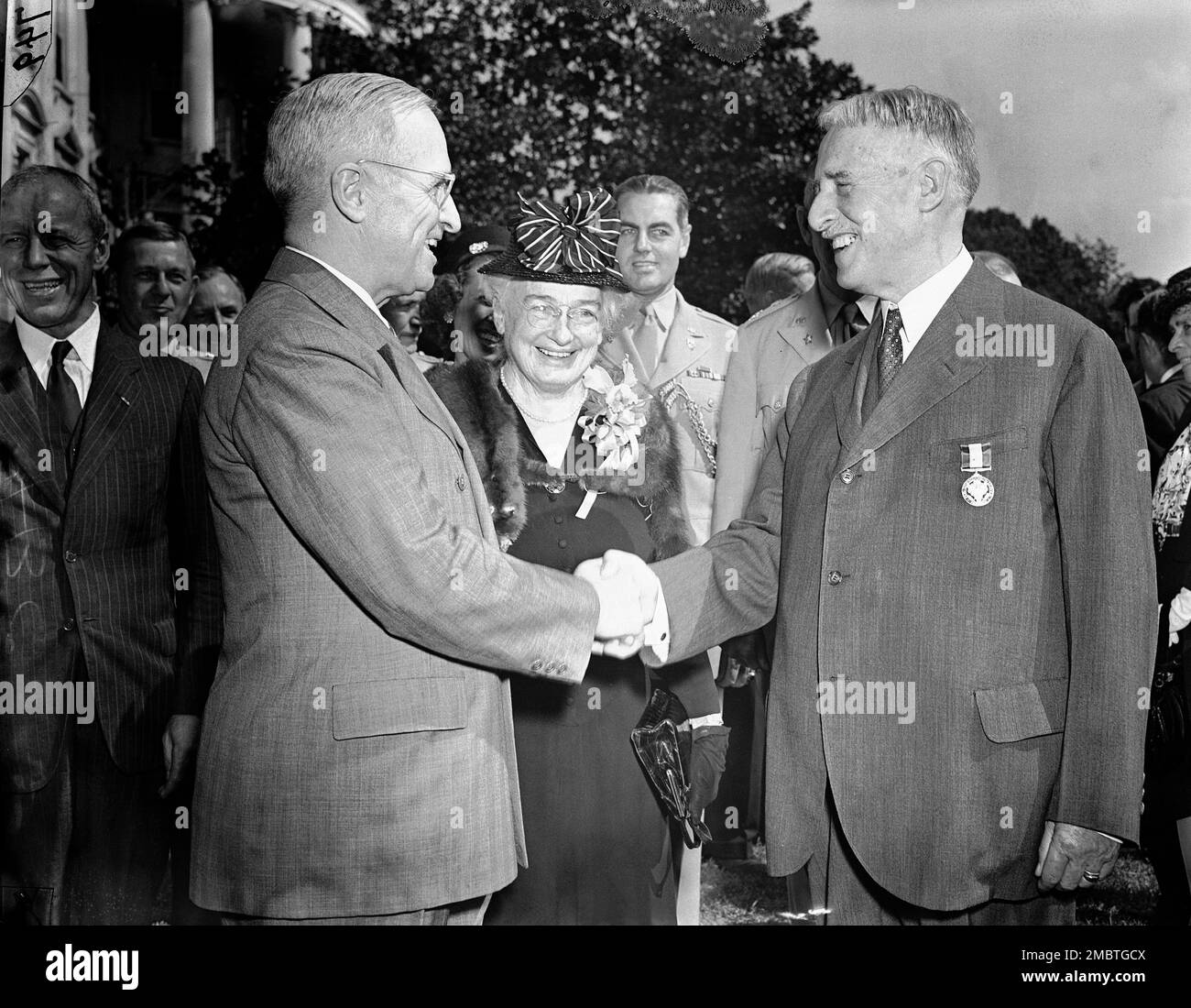 Henry L. Stimson, right, is congratulated by President Harry S. Truman ...