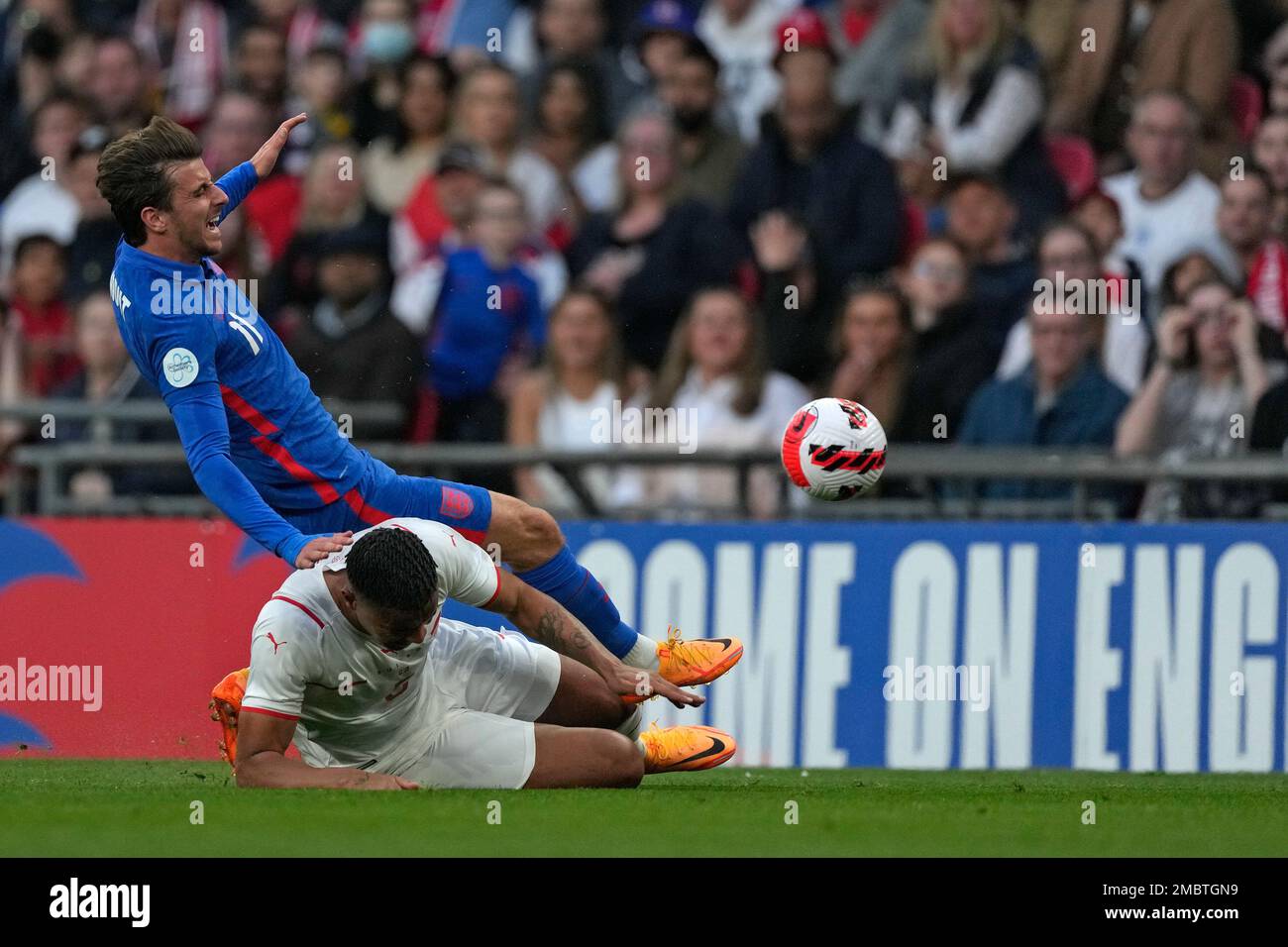 England's Mason Mount, top, is challenged by Switzerland's Manuel ...