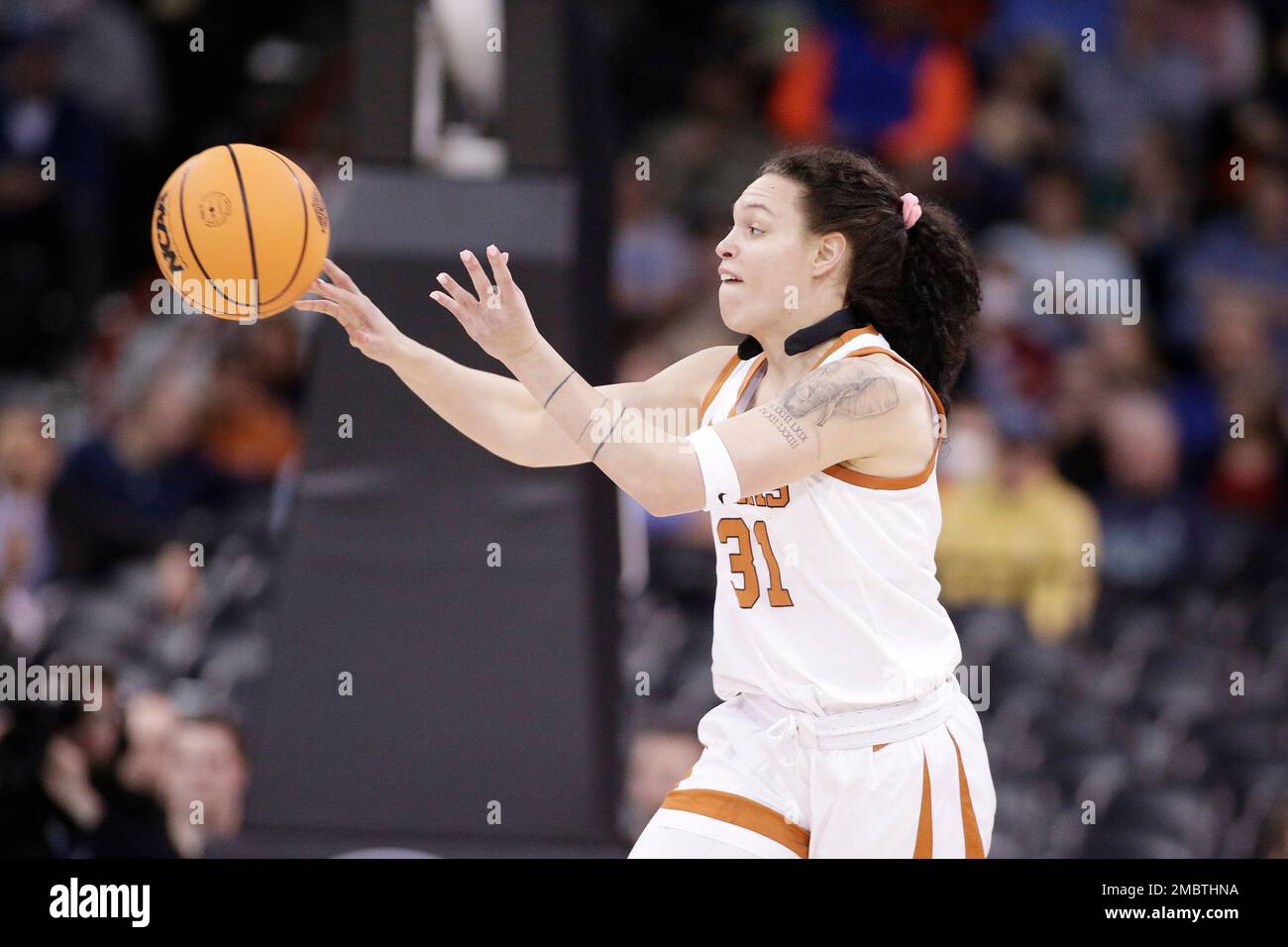 Texas guard Audrey Warren passes the ball during a college basketball ...