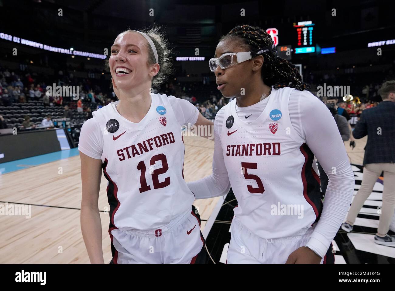 Stanford guard Lexie Hull (12) and forward Francesca Belibi (5) react ...