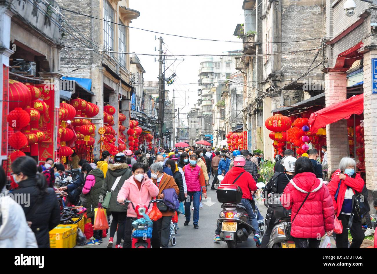 Chinese people choose New Year goods at the Shuijie Street Market for ...