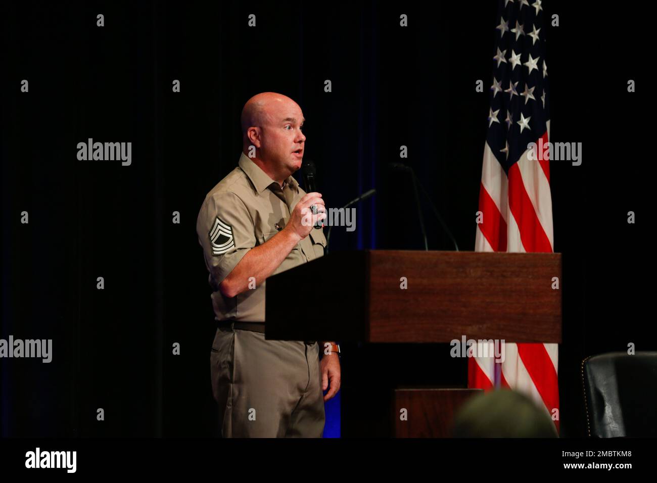 Army Master Sgt. Chad Emrick sings the National Anthem during the ESGR ...