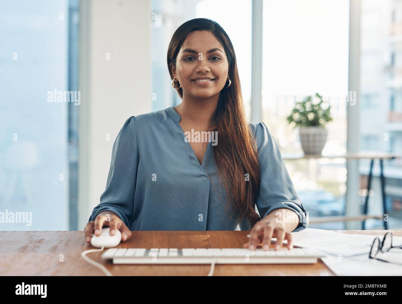 Getting it all done with just a few clicks. Portrait of a young ...
