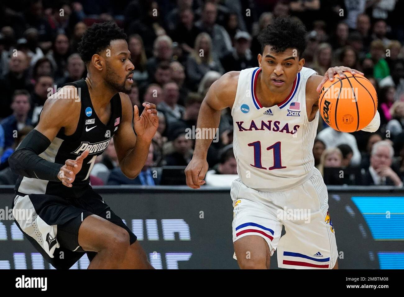 Kansas' Remy Martin drives past Providence's Al Durham during the ...