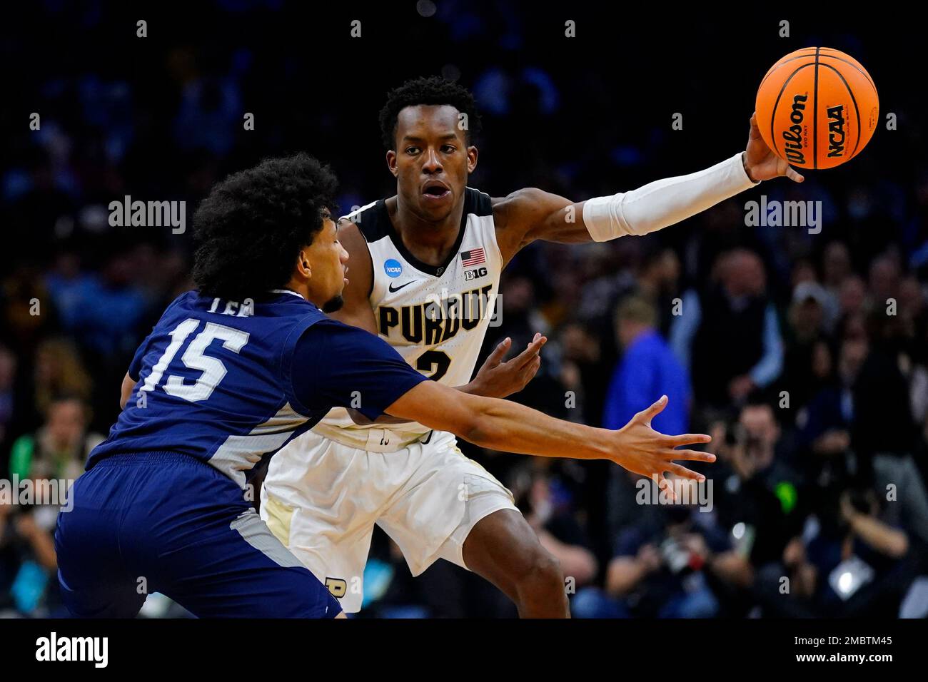 Purdue's Eric Hunter Jr., right, passes against Saint Peter's Matthew ...