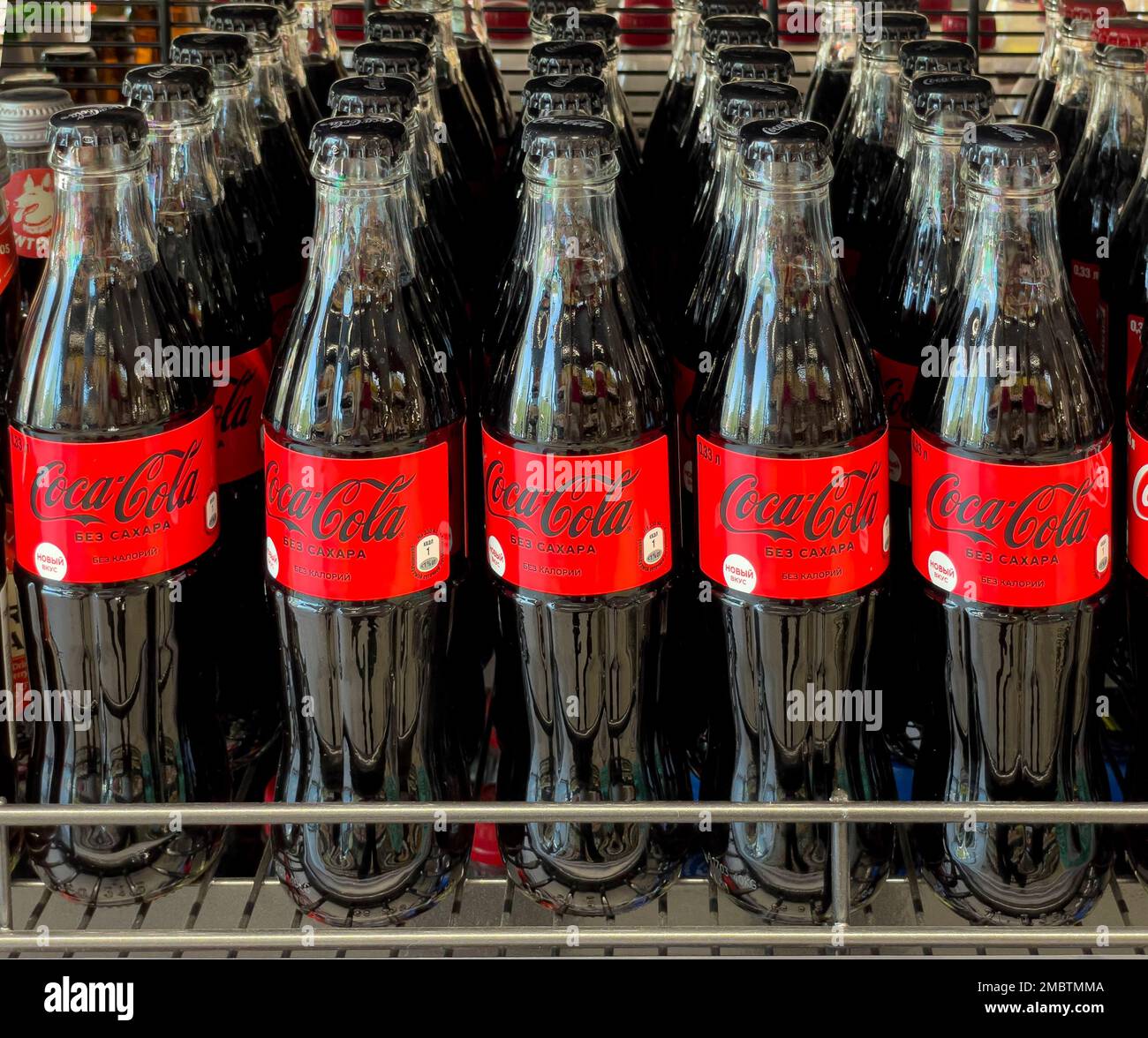 Anapa, Russia April 28, 2022:Bottles of Coca Cola on the shelves in the ...