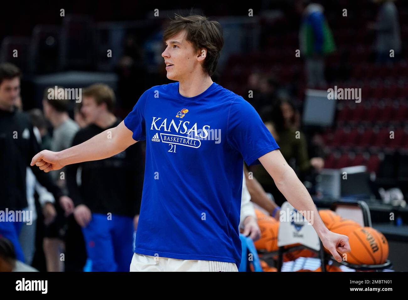 Kansas's Zach Clemence warms up before a college basketball game in the ...