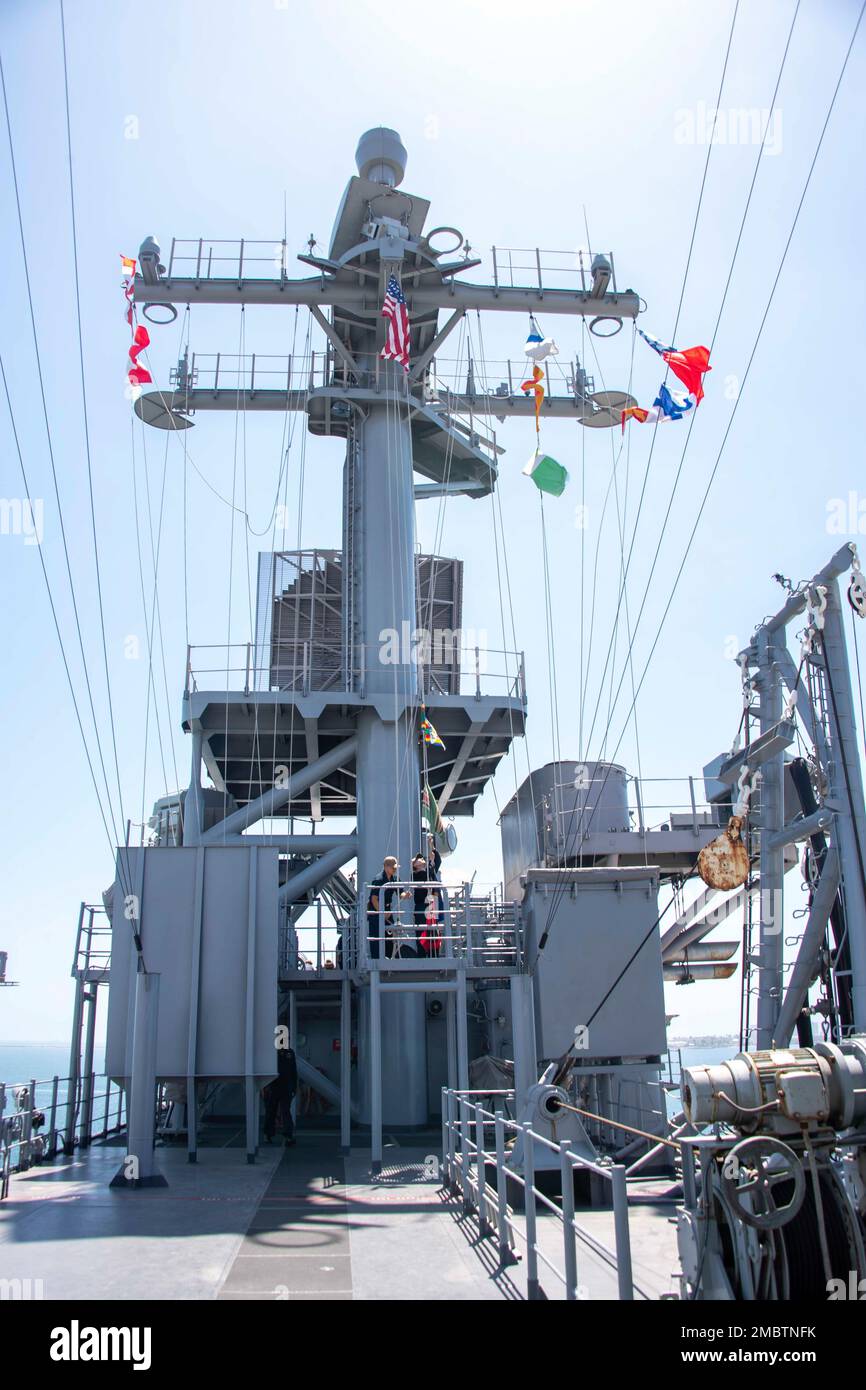 SAN DIEGO (June 21, 2022) Sailors aboard the USS BOXER, lower the award ...