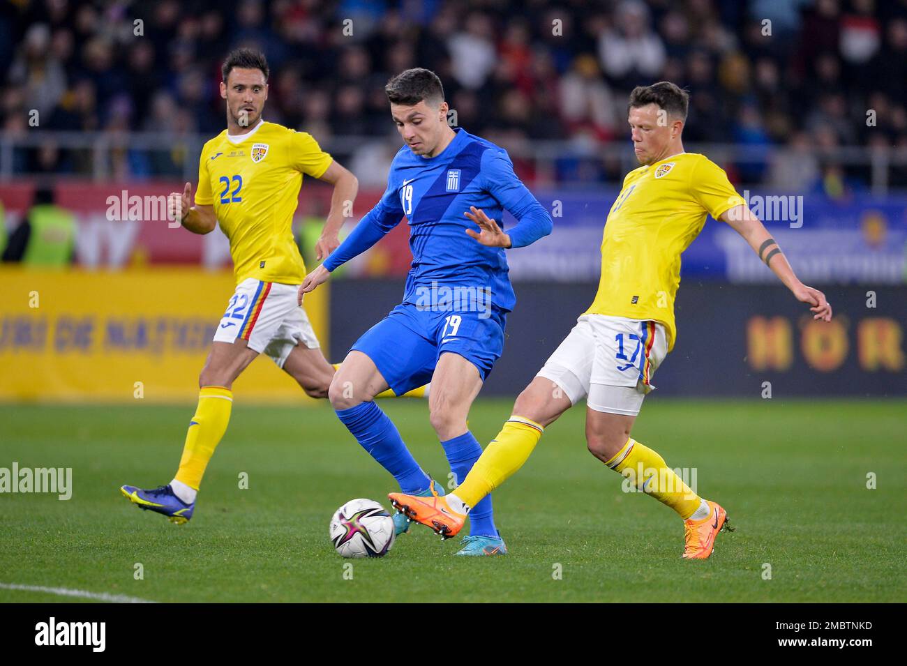 Greece's Pantelis Hatzidiakos, center, challenges for the ball with ...