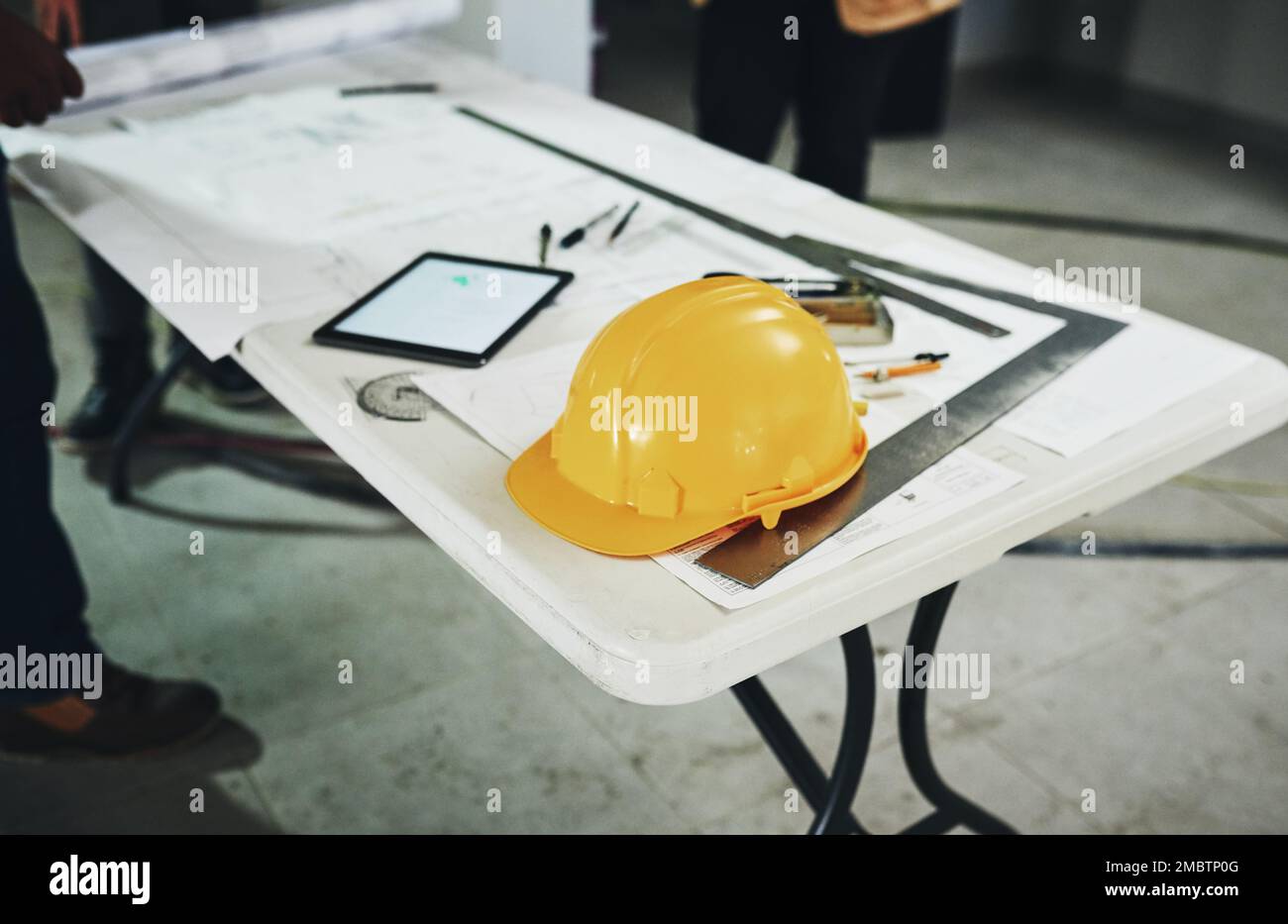 Safety is always part of the plan. various tools and a blueprint on a ...