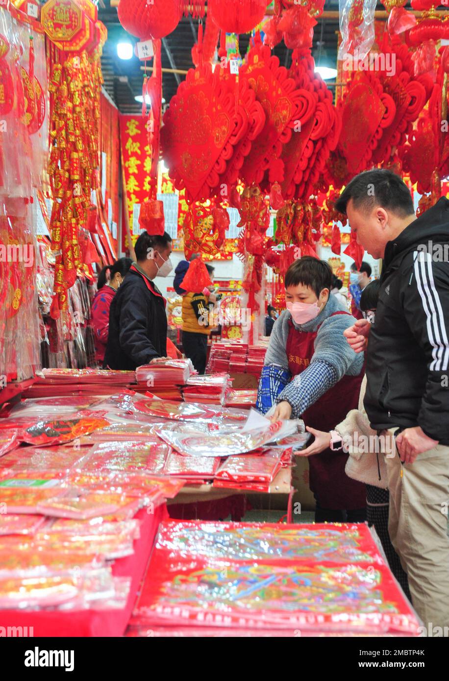 Chinese people choose New Year goods at the Shuijie Street Market for ...