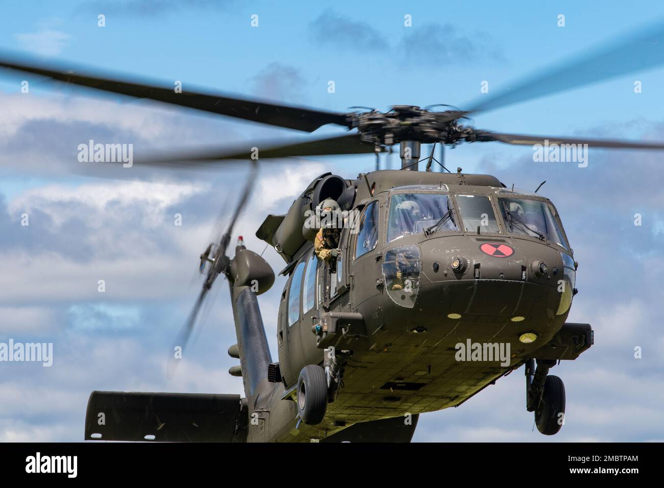 A UH-60 Black Hawk crew chief assigned to 2-158 Assault Helicopter ...