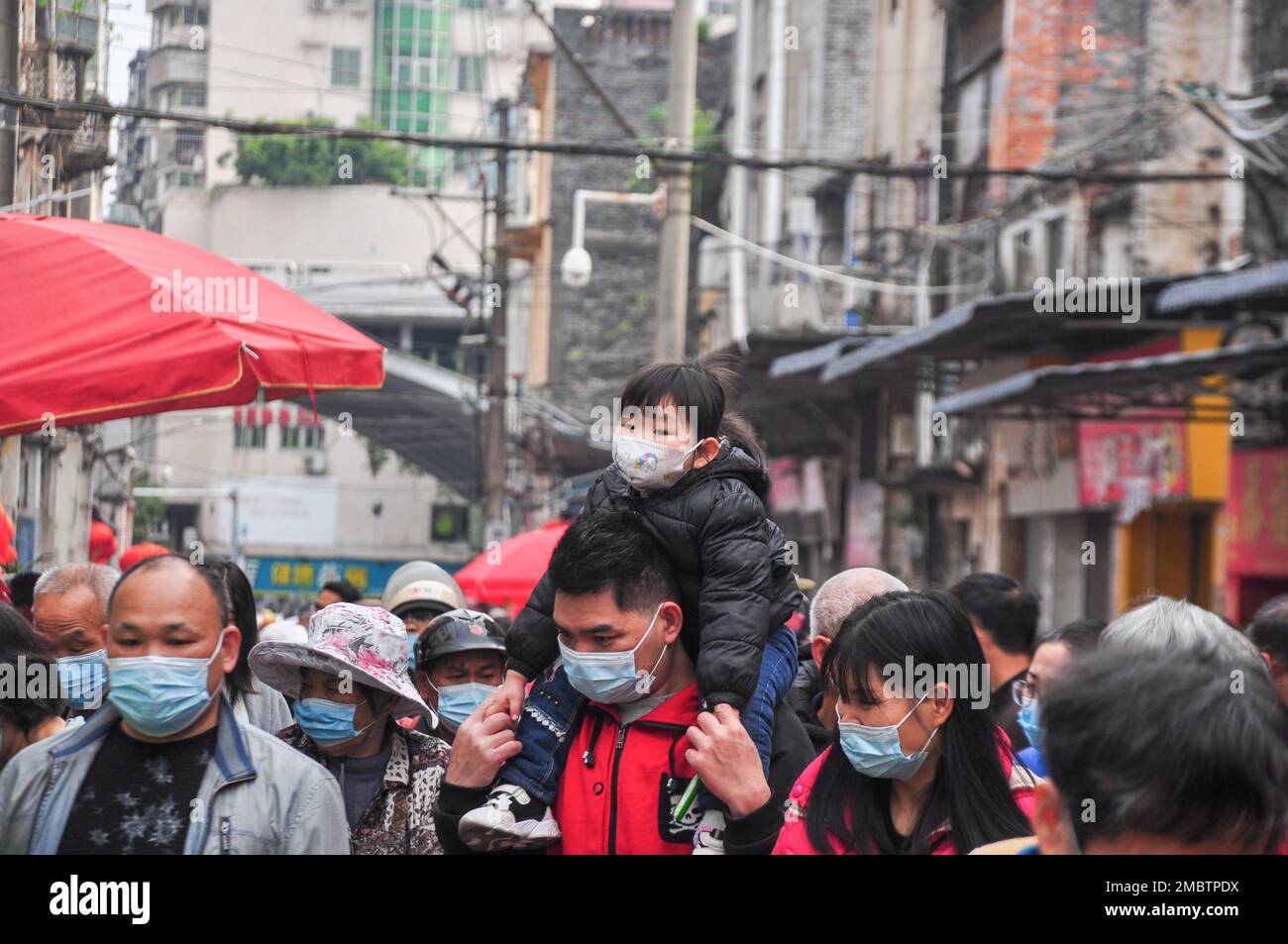 Chinese people choose New Year goods at the Shuijie Street Market for ...