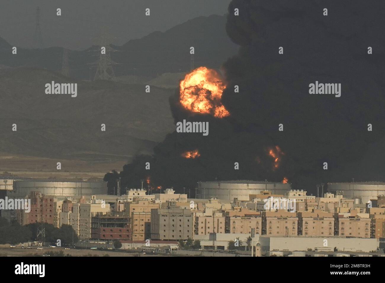 A cloud of smoke rises from a burning oil depot in Jiddah, Saudi Arabia ...