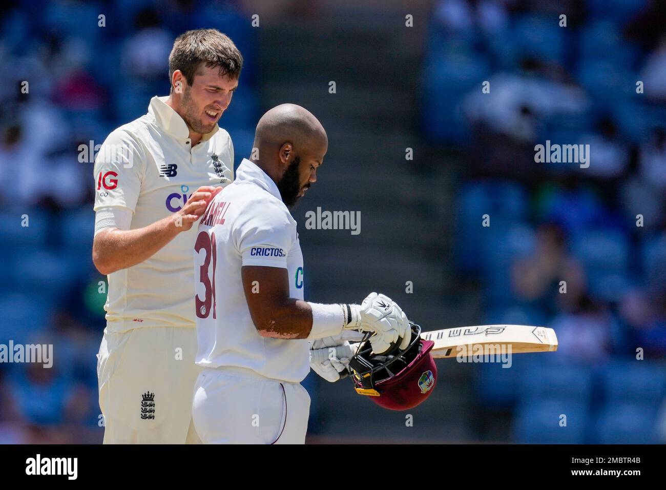 England's Craig Overton talks to West Indies' John Campbell after one ...