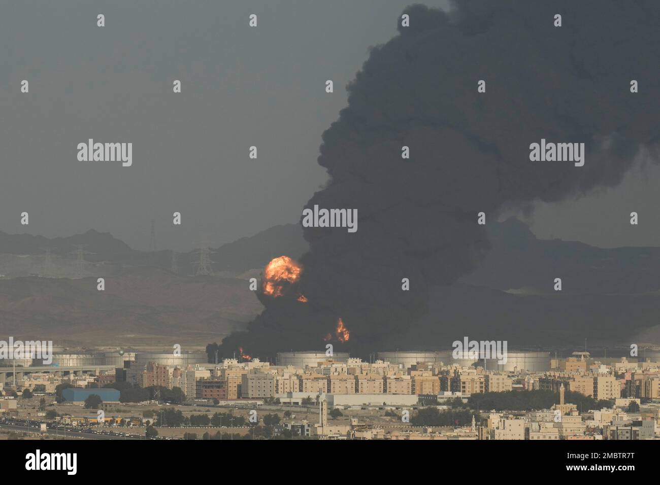 A cloud of smoke rises from a burning oil depot in Jiddah, Saudi Arabia ...