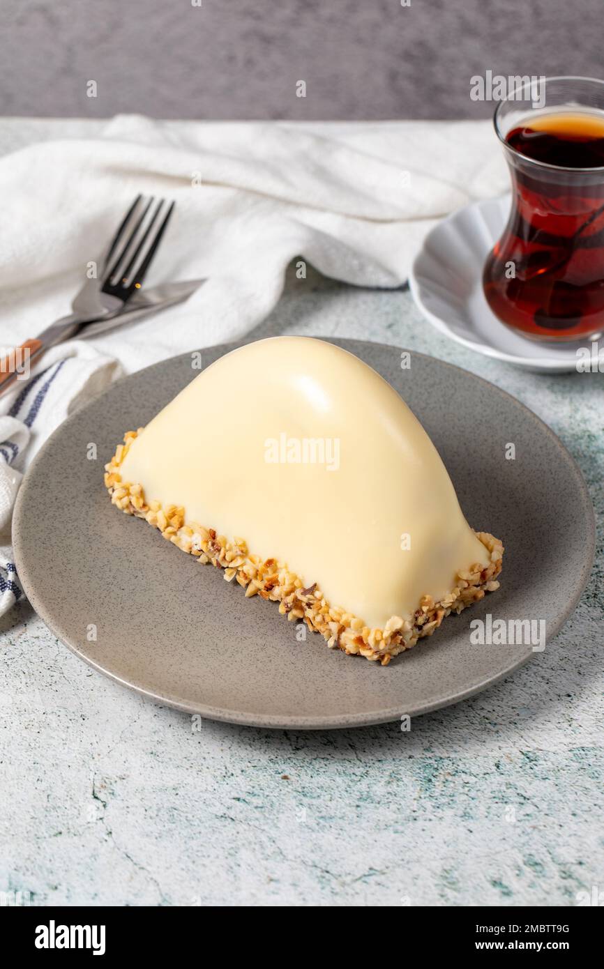 White Chocolate Banana Cake. Malaga cake with banana inside, chocolate and hazelnut outside on a ...