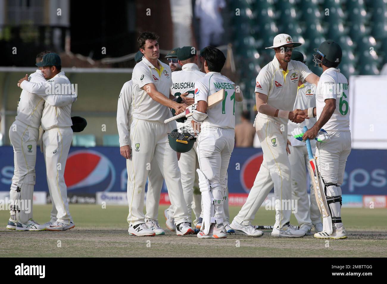 Australia's Pat Cummins, center, and teammates shake hand with ...