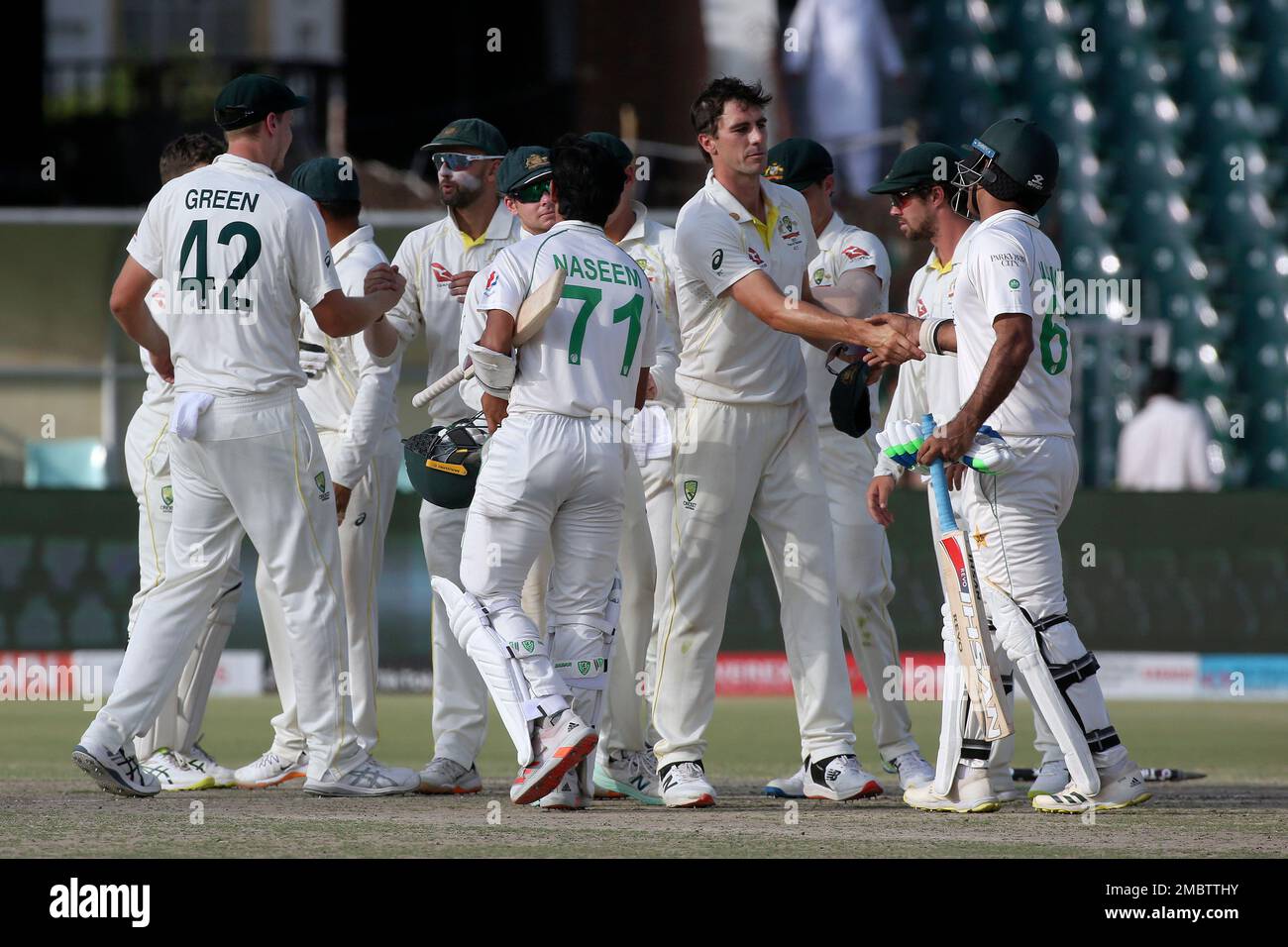 Australia's Pat Cummins, third right, and teammates shake hand with ...