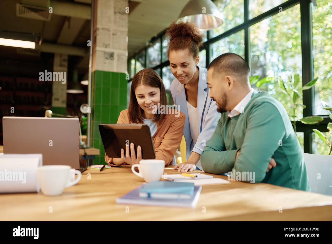 Smiling multiethnic men using hi-res stock photography and images - Alamy