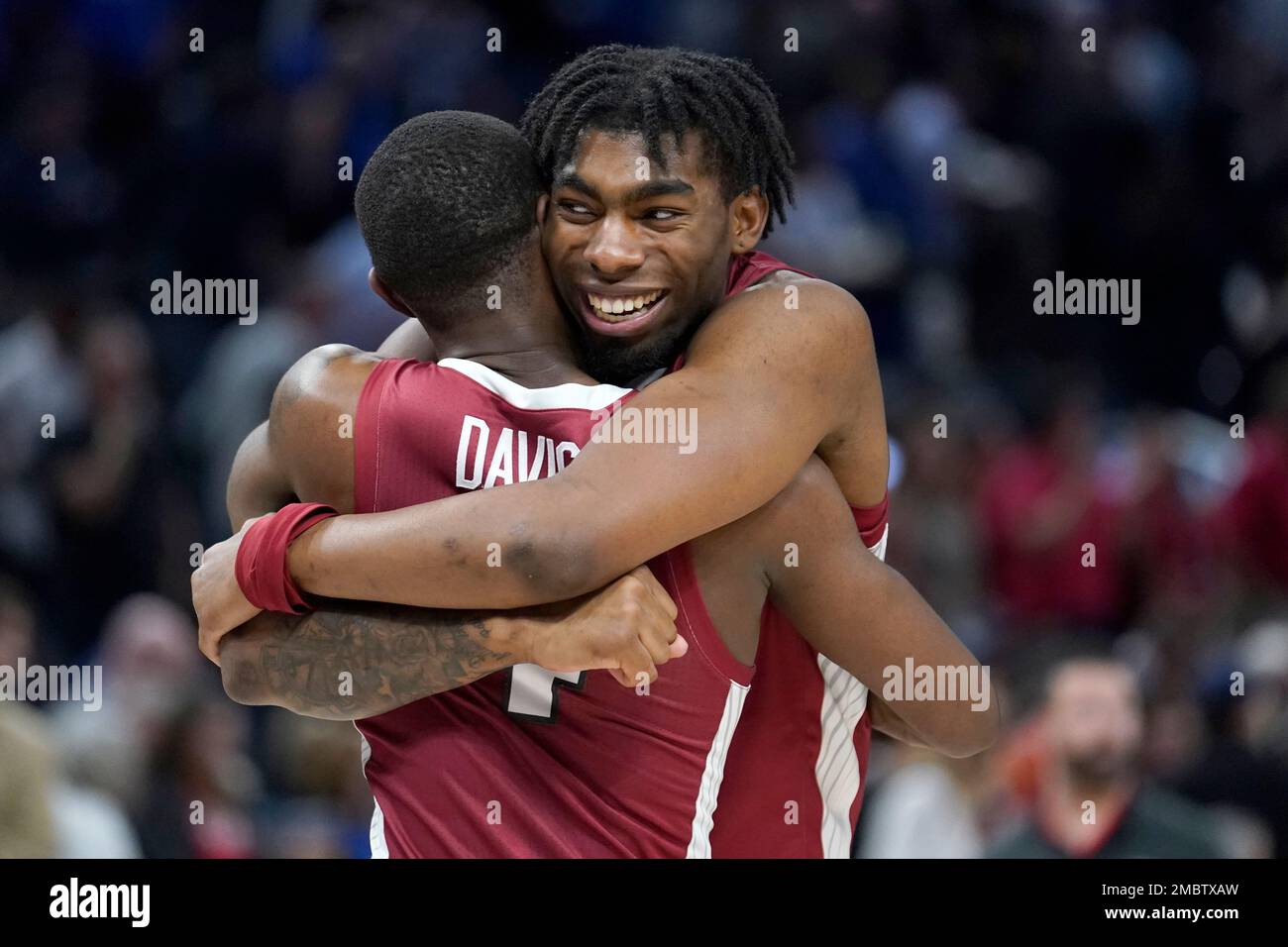 Arkansas guard Davonte Davis, left, celebrates with forward Kamani ...