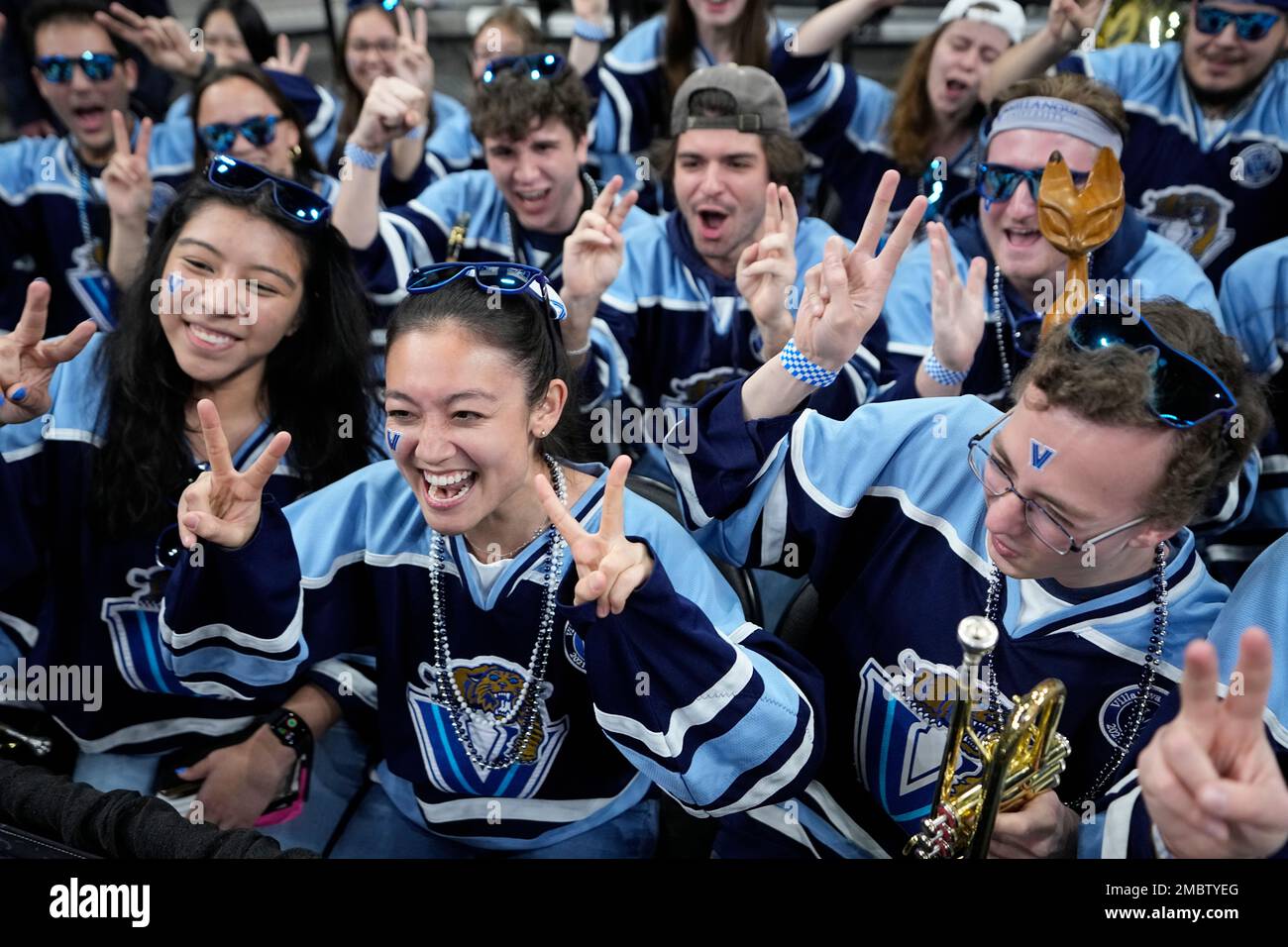 Members of them Villanova band cheer before a college basketball game ...