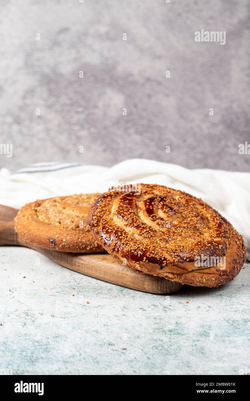 Poppy bread. Bread prepared with poppy on stone background. close up ...