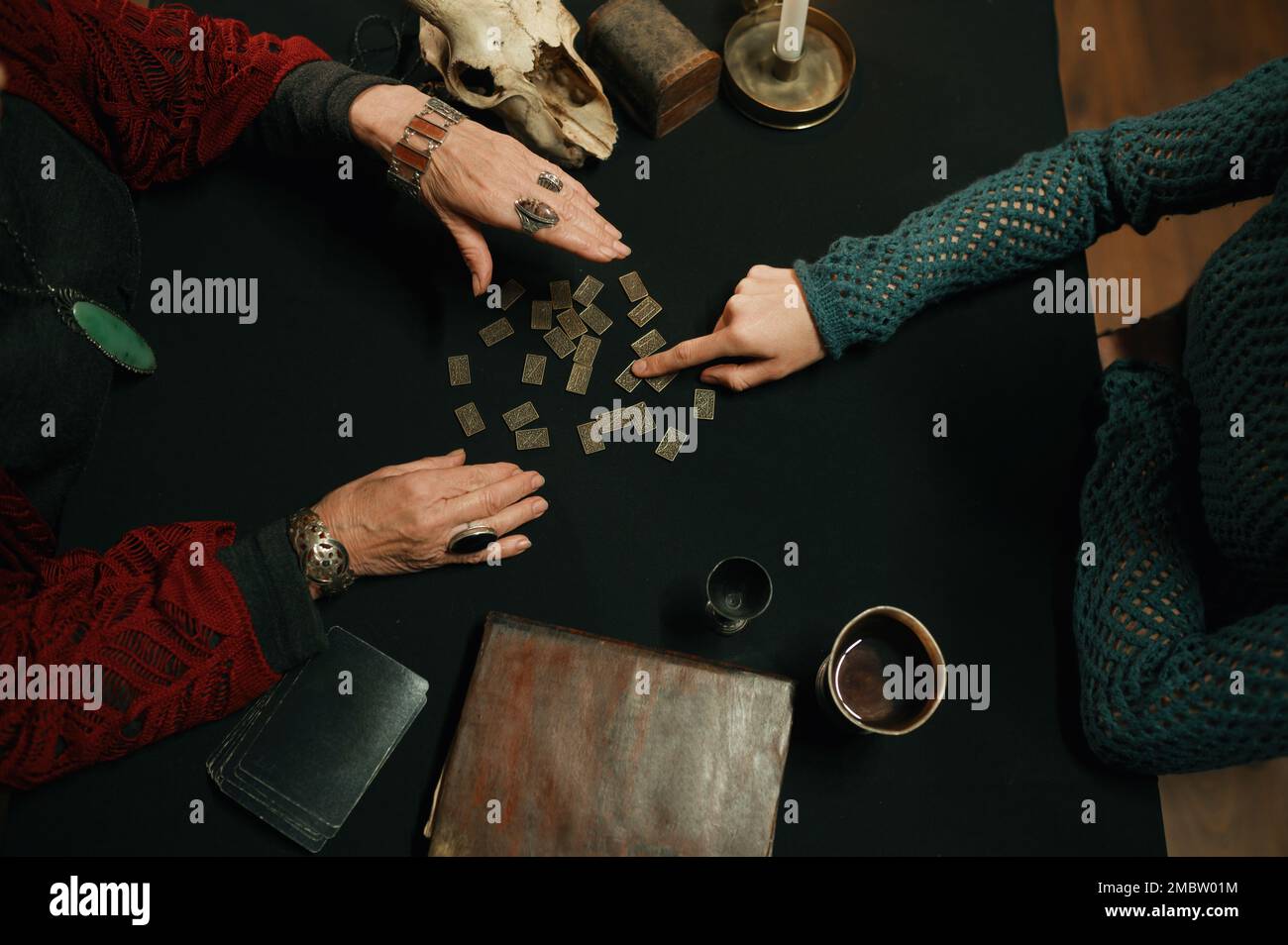 Old mature witch giving prediction using spiritual attributes closeup ...