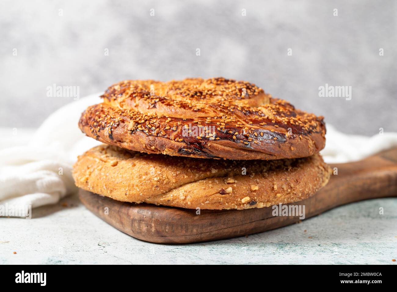 Poppy bread. Bread prepared with poppy on stone background. close up ...