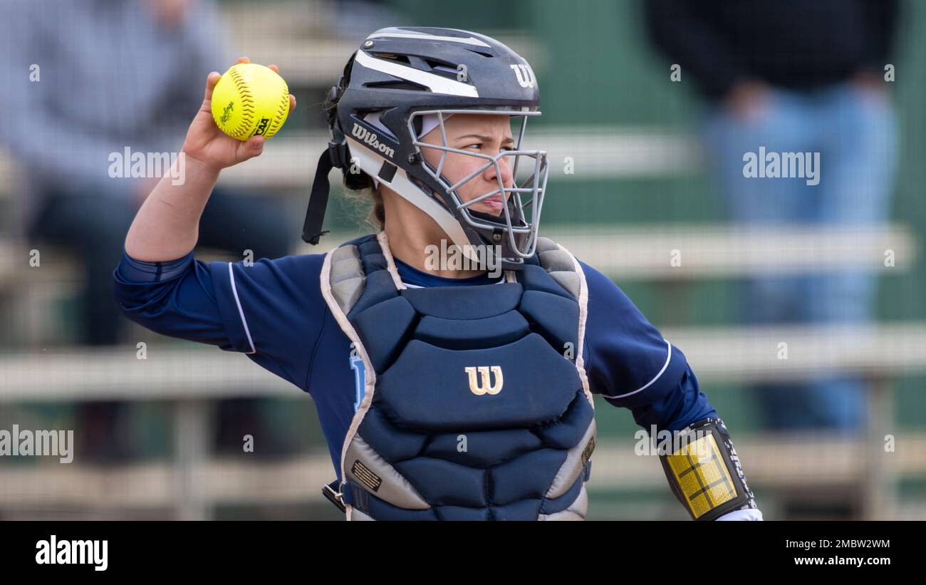 Maine catcher Kennedy Priest (17) throws the ball during an NCAA ...