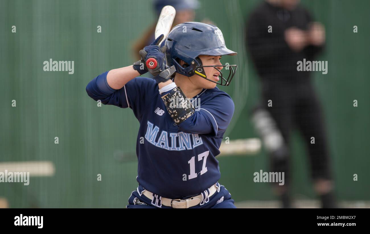 Maine catcher Kennedy Priest (17) bats during an NCAA softball game on ...