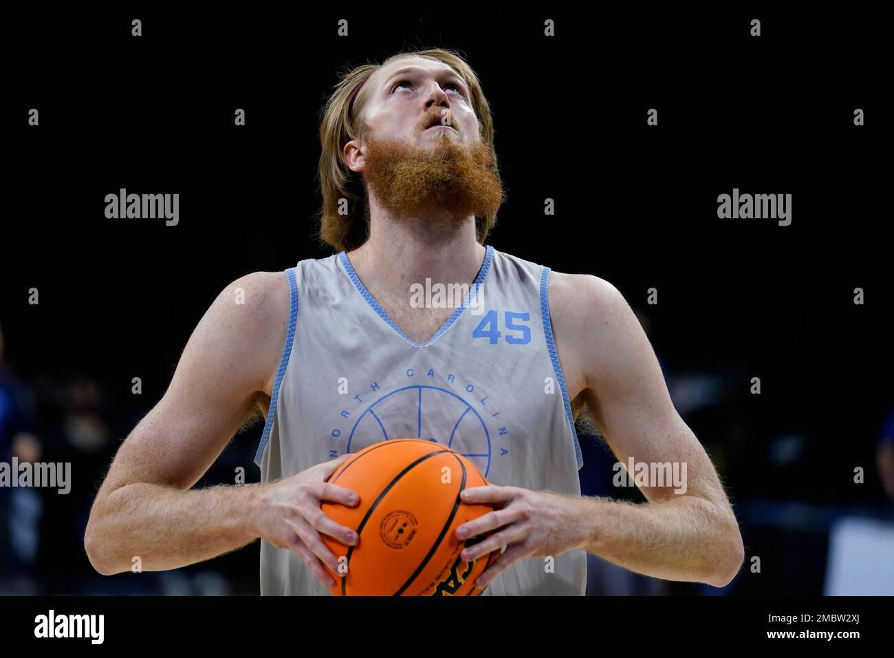 North Carolina's Brady Manek warms up during practice for the NCAA men ...
