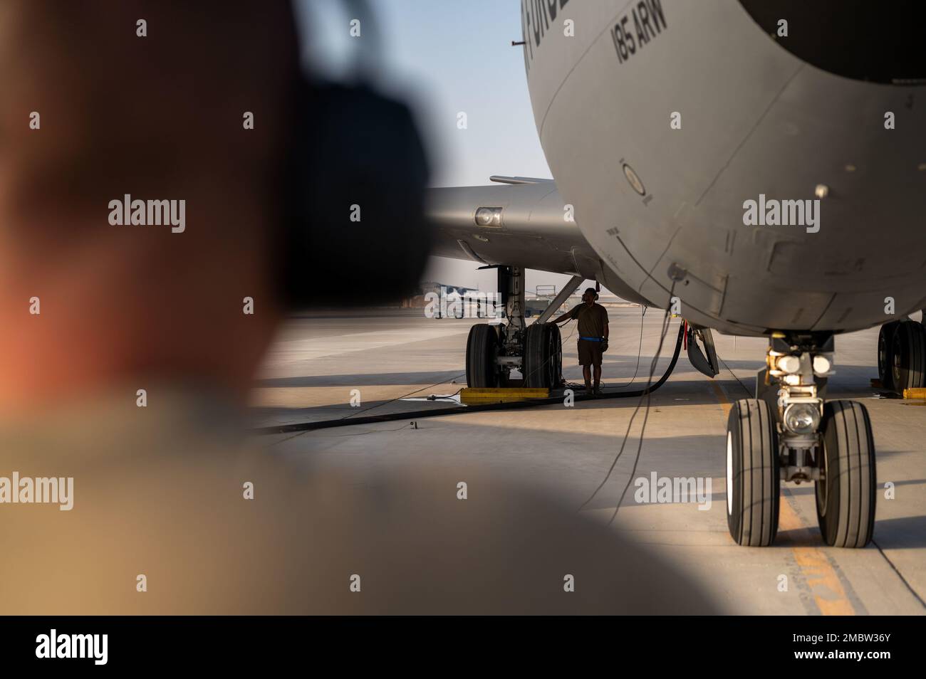 U.S. Air Force Airman perform a hot pit refuel with a KC-135 ...