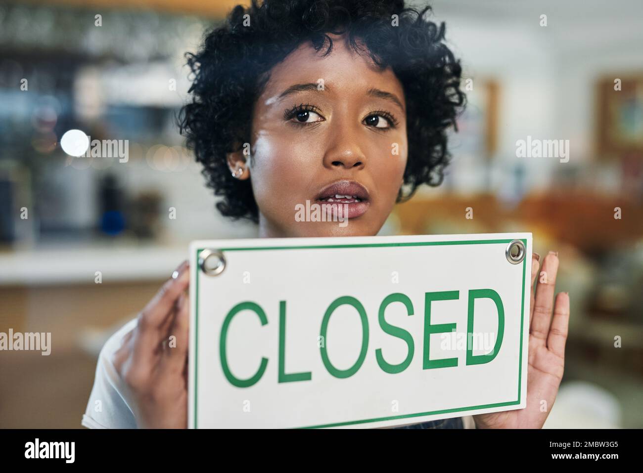 Its been a difficult time for small businesses. a young woman holding a ...