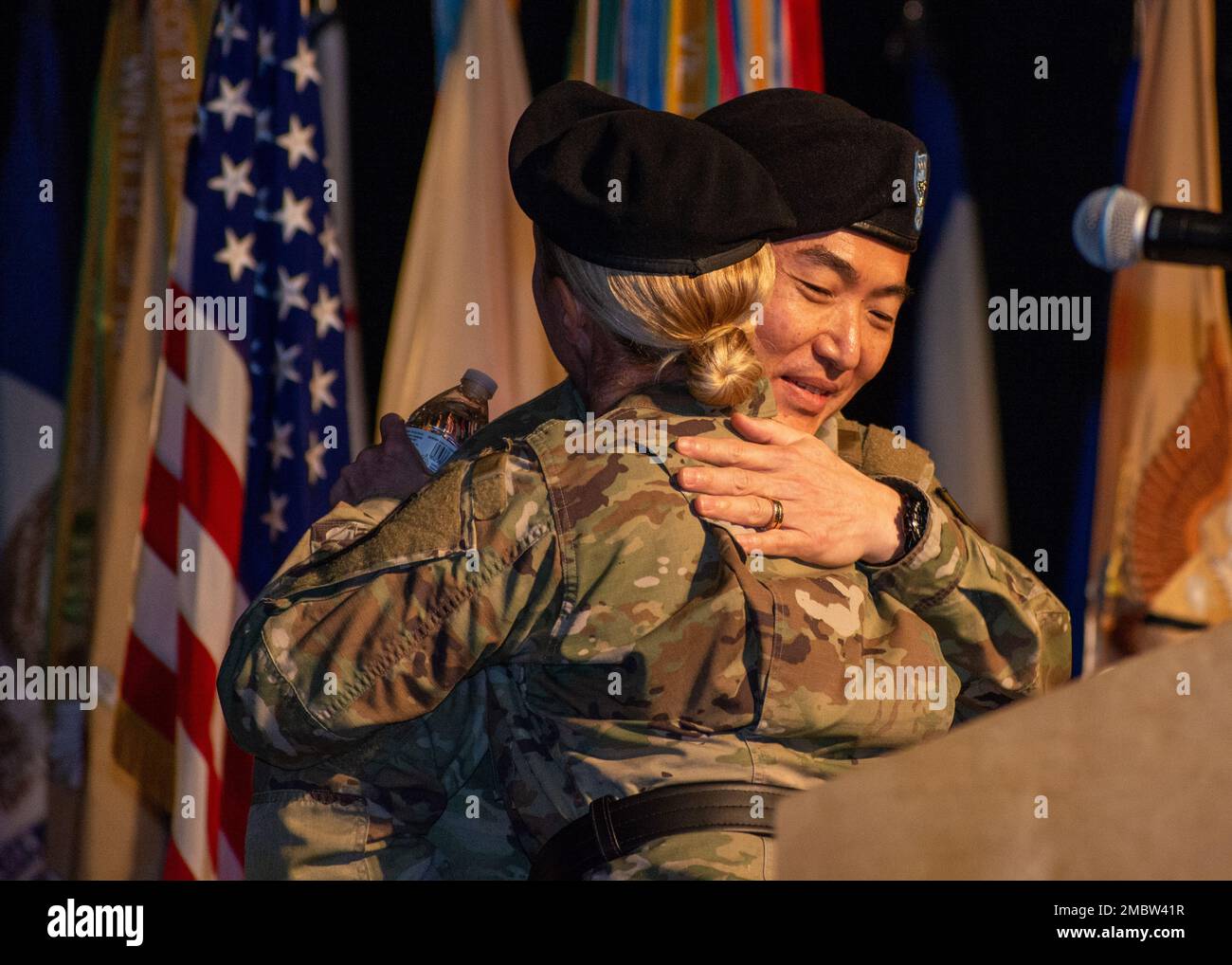 Col. Michael B. Siegl, incoming Quartermaster General and QM School commandant, embraces ...