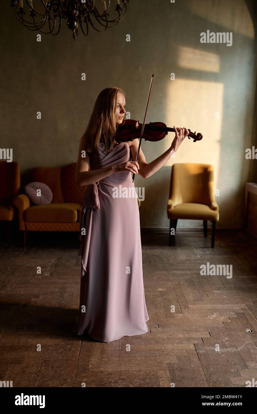 Woman practicing the violin hi-res stock photography and images - Alamy