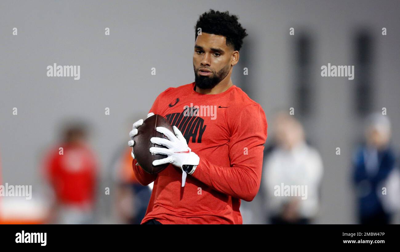 Wide receiver Chris Olave runs a football drill during Ohio State Pro ...