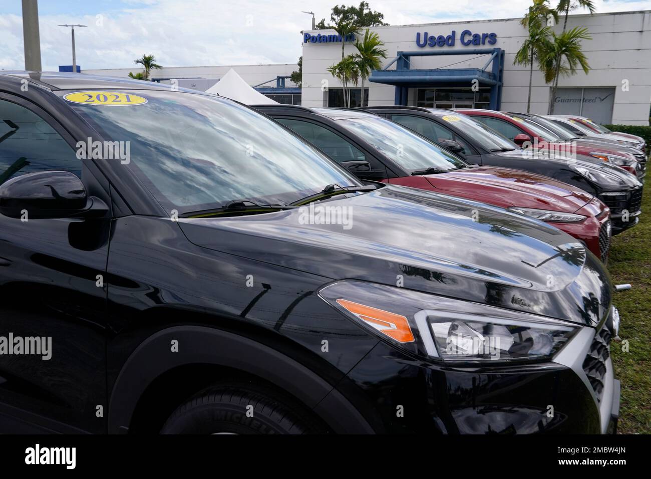 A line of cars are for sale at the Potamkin Hyundai dealership used car ...