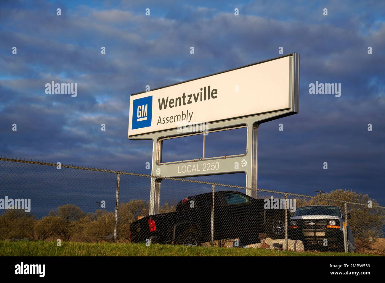 A sign stands near an entrance to a General Motors assembly plant ...