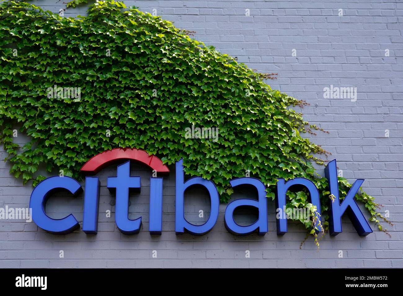 ** PLEASE HOLD FOR BIZ ** Ivy partially covers a sign outside a ...