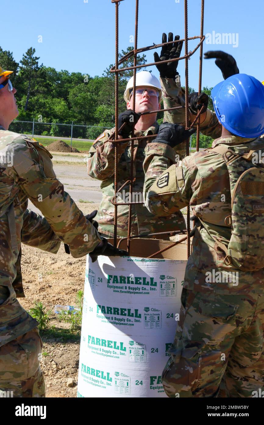 Army Reserve Sgt. Paul Reap, center, an engineer with 601st Engineer ...