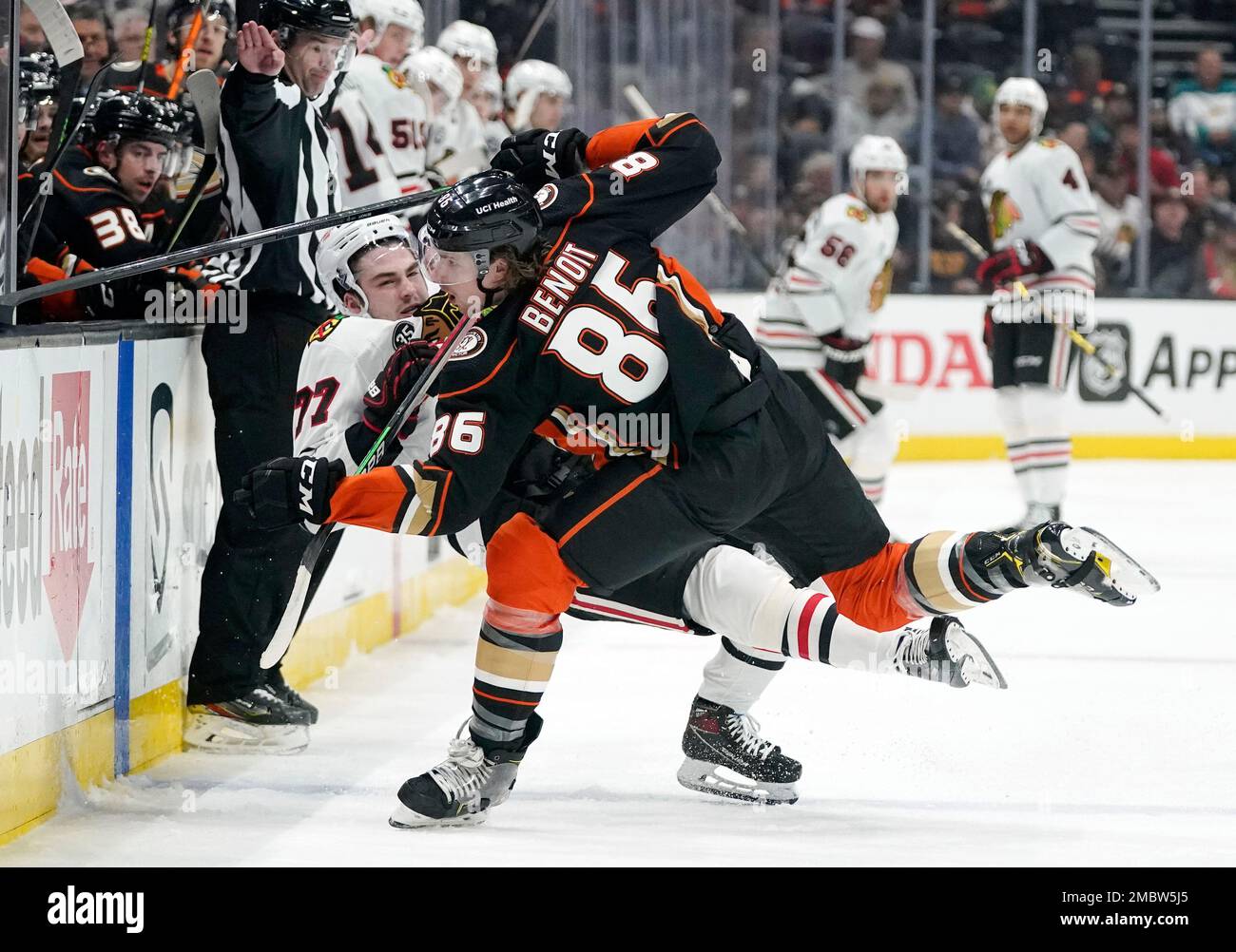 Anaheim Ducks defenseman Simon Benoit, right, checks Chicago Blackhawks ...
