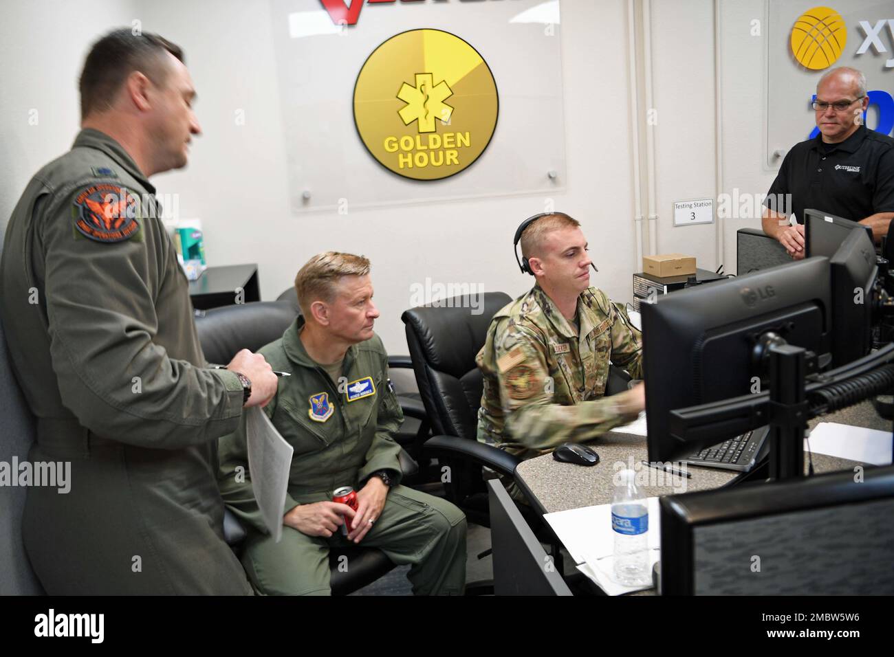 Staff Sgt. Kyle Snedeker, center-right, a tactical data link manager ...