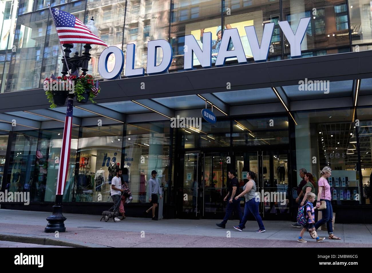 Pedestrians pass the Old Navy store in the Downtown Crossing shopping ...