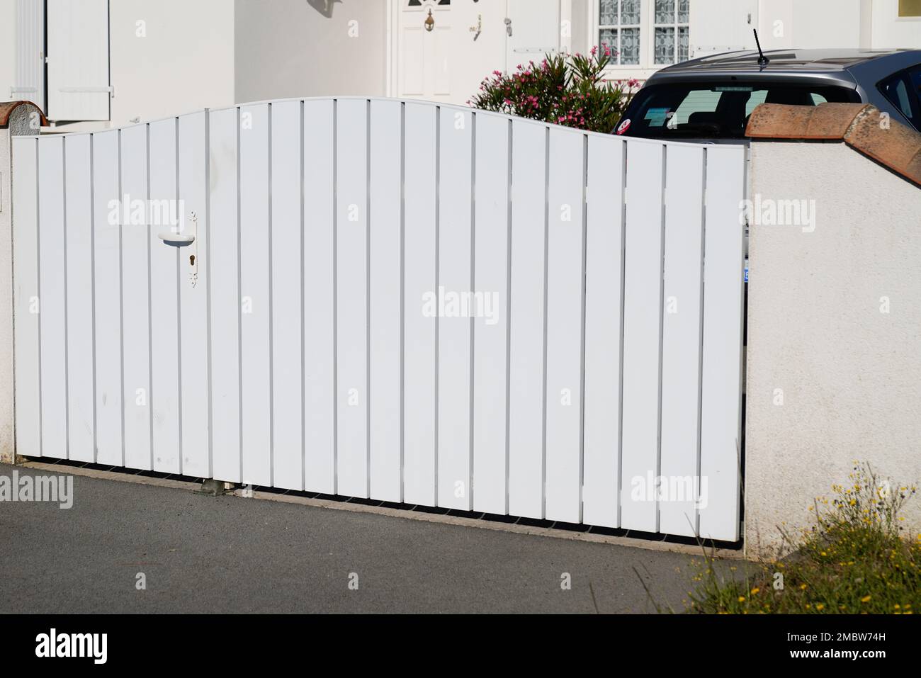 pvc plastic white gate of suburb house Stock Photo - Alamy