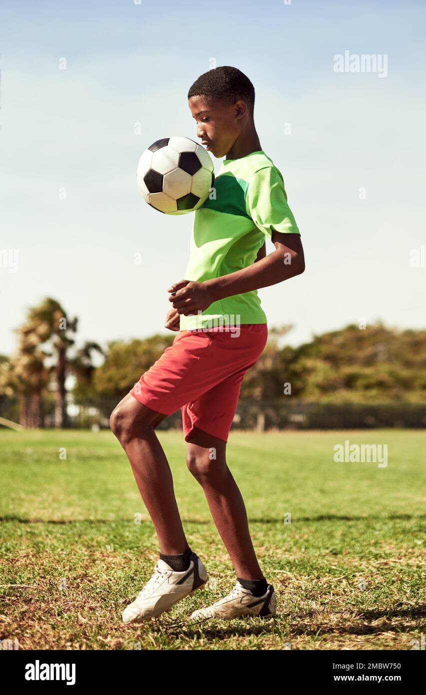 Good players practice until they get it right. a young boy playing ...