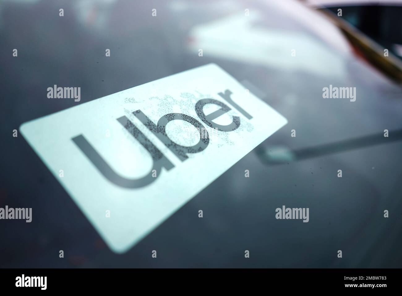 An Uber sign is displayed inside a car in Palatine, Ill., Thursday, Feb ...