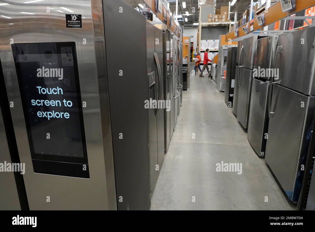 Passers-by walk past refrigerators on display, Thursday, Oct. 29, 2020 ...