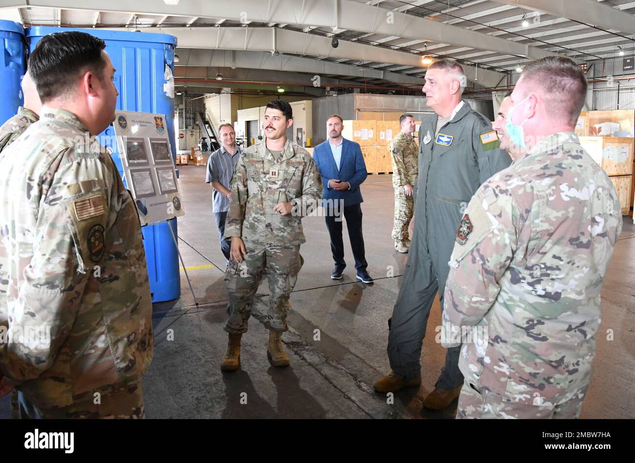 U.S. Air Force Capt. Adrian Nuanes, center left, 735th Air Mobility ...