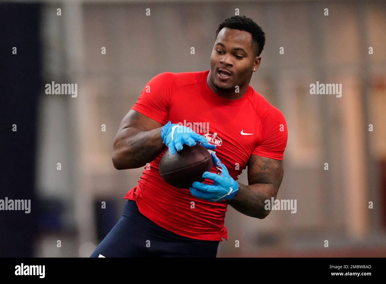 Defensive lineman Sam Williams catches a ball during a football drill ...
